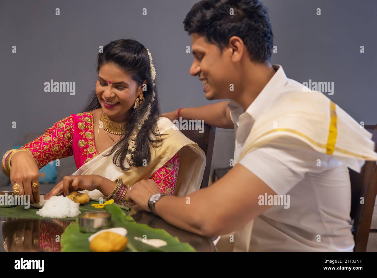Happy couple having Onam Sadhya together at home Stock Photo - Alamy
