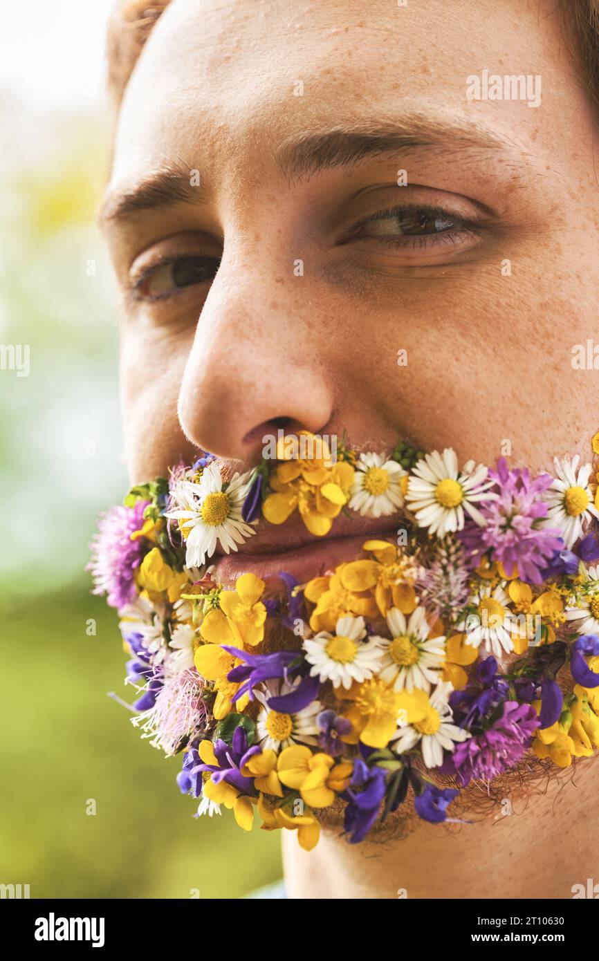 Within the forest's embrace, one discerns a man, his face a garden of ...