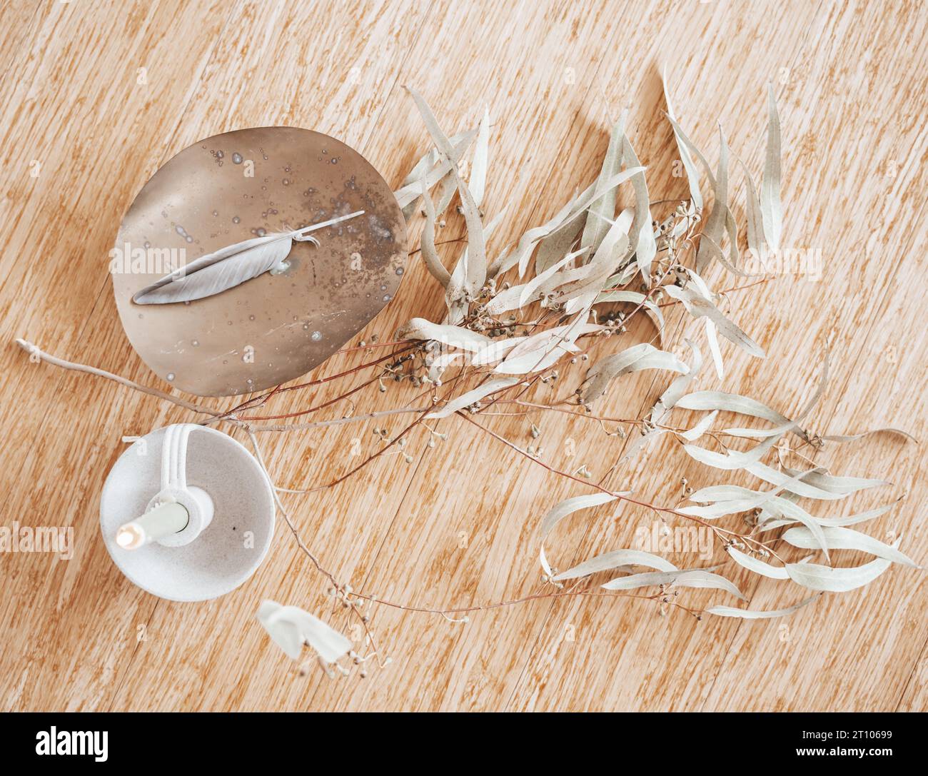 An abstract still life composition featuring a metallic object, a sheet ...