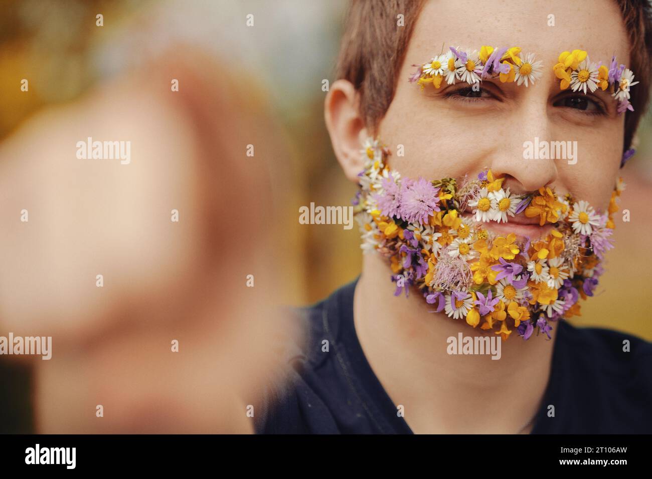 Spring blooms take the place of a man's beard and eyebrows. He exudes ...