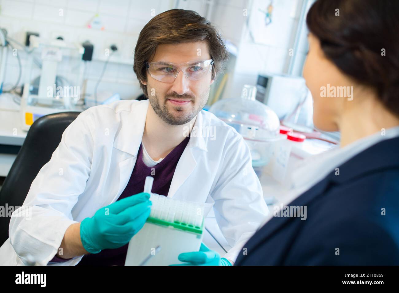 Lab worker in suit holding hi-res stock photography and images - Alamy