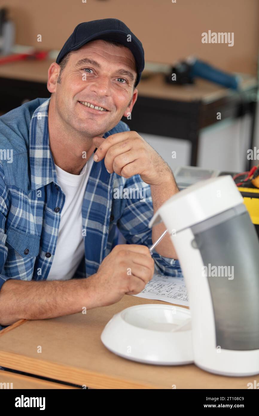 professional worker fixing coffee machine Stock Photo - Alamy