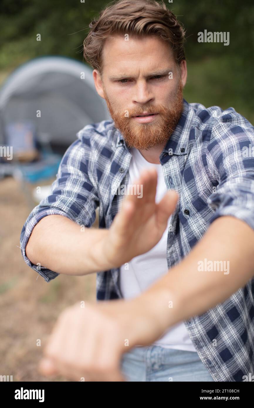 mosquito attack a man in forest camping Stock Photo - Alamy
