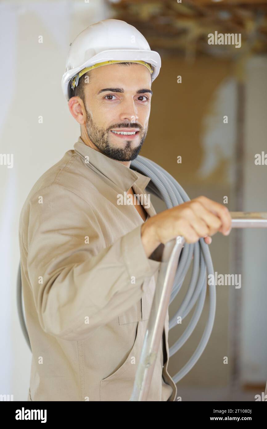 portrait of plumber working with pipes Stock Photo - Alamy