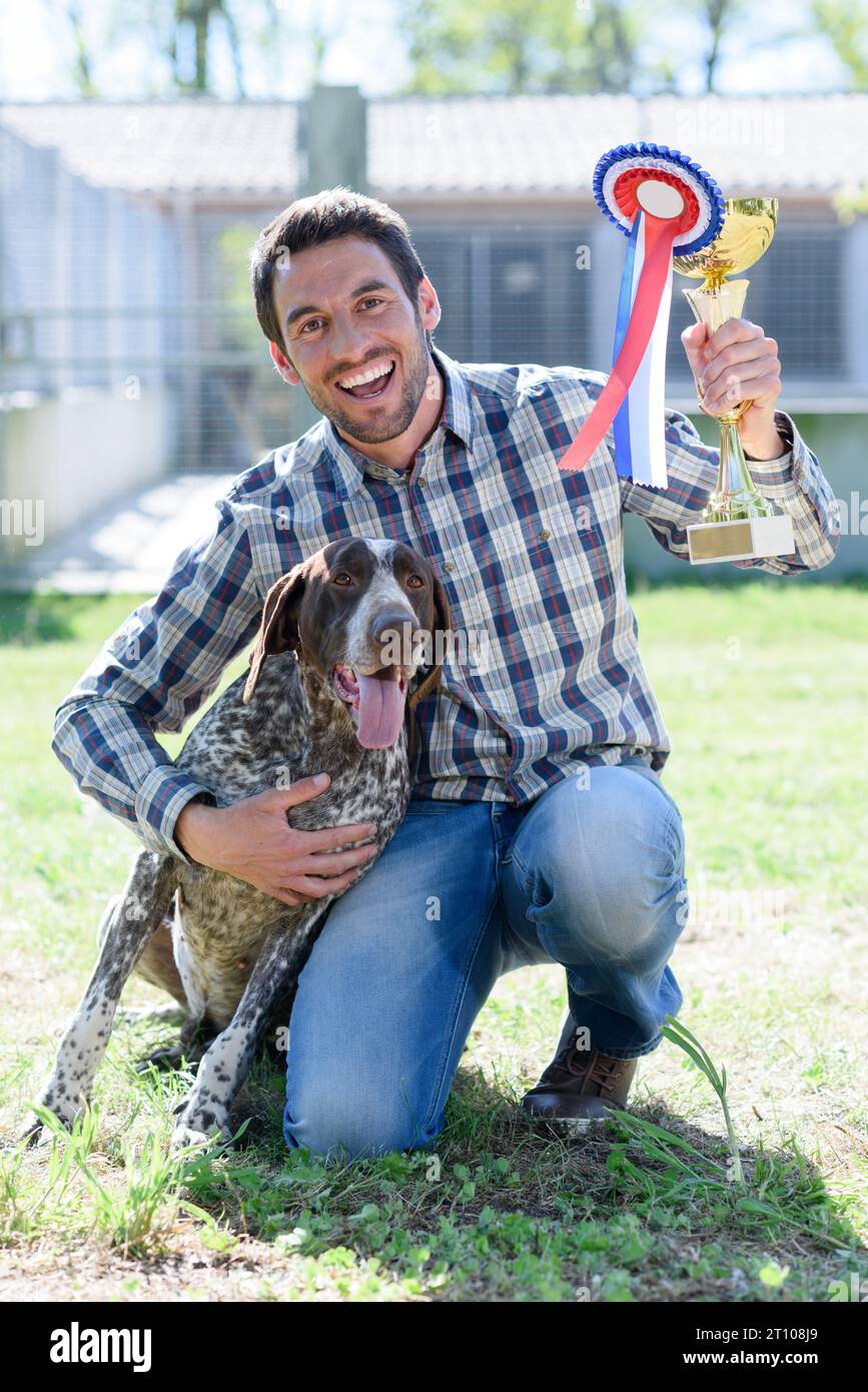 dog owner and winner dog Stock Photo - Alamy