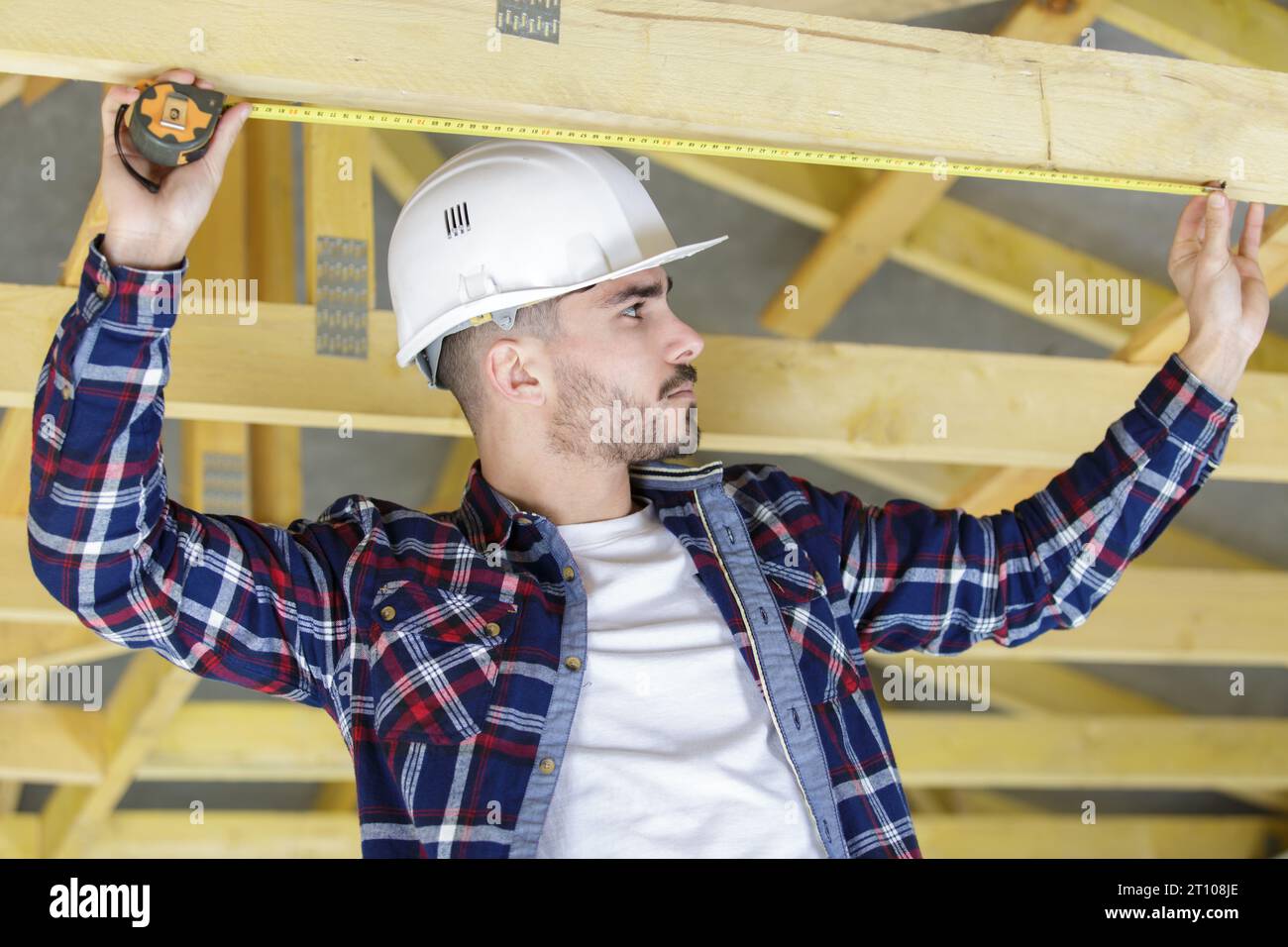 Builder measuring height tape measure hi-res stock photography and ...
