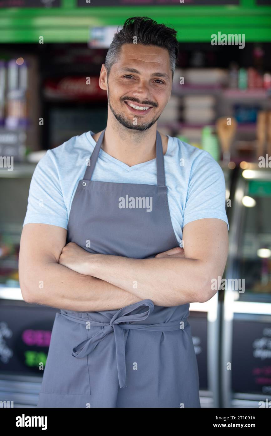 portrait of male worker outside his ice-cream parlour Stock Photo - Alamy