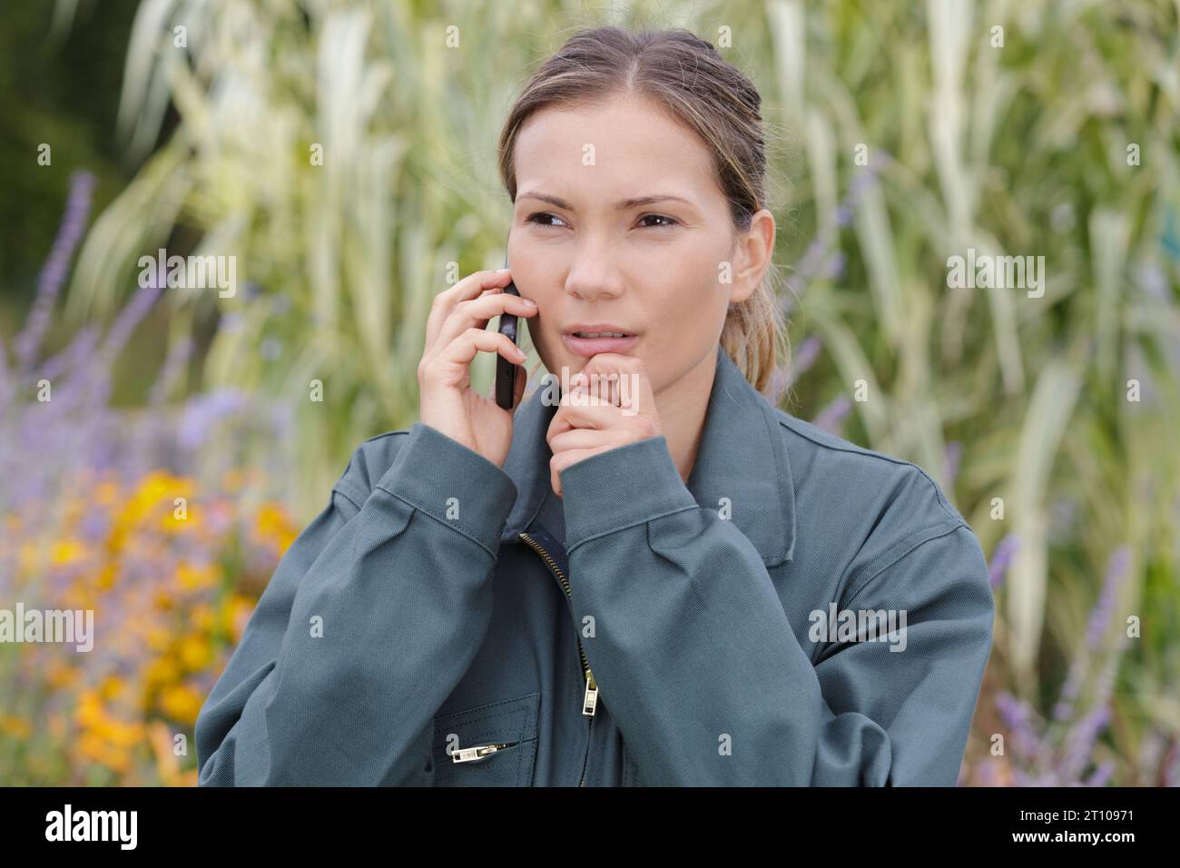 Beautiful young woman gardener hi-res stock photography and images - Alamy