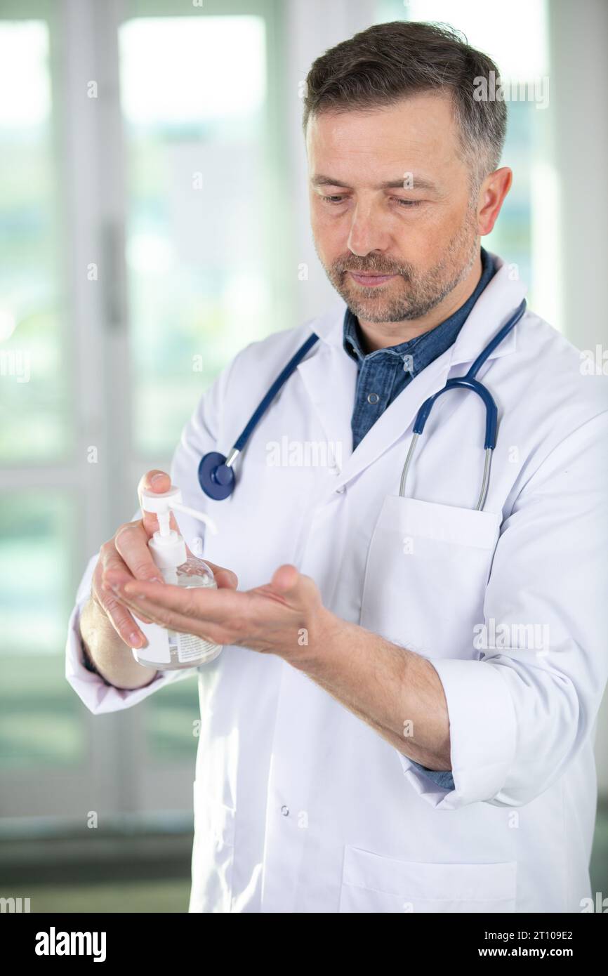 selective focus on the doctor cleaning his hands Stock Photo - Alamy