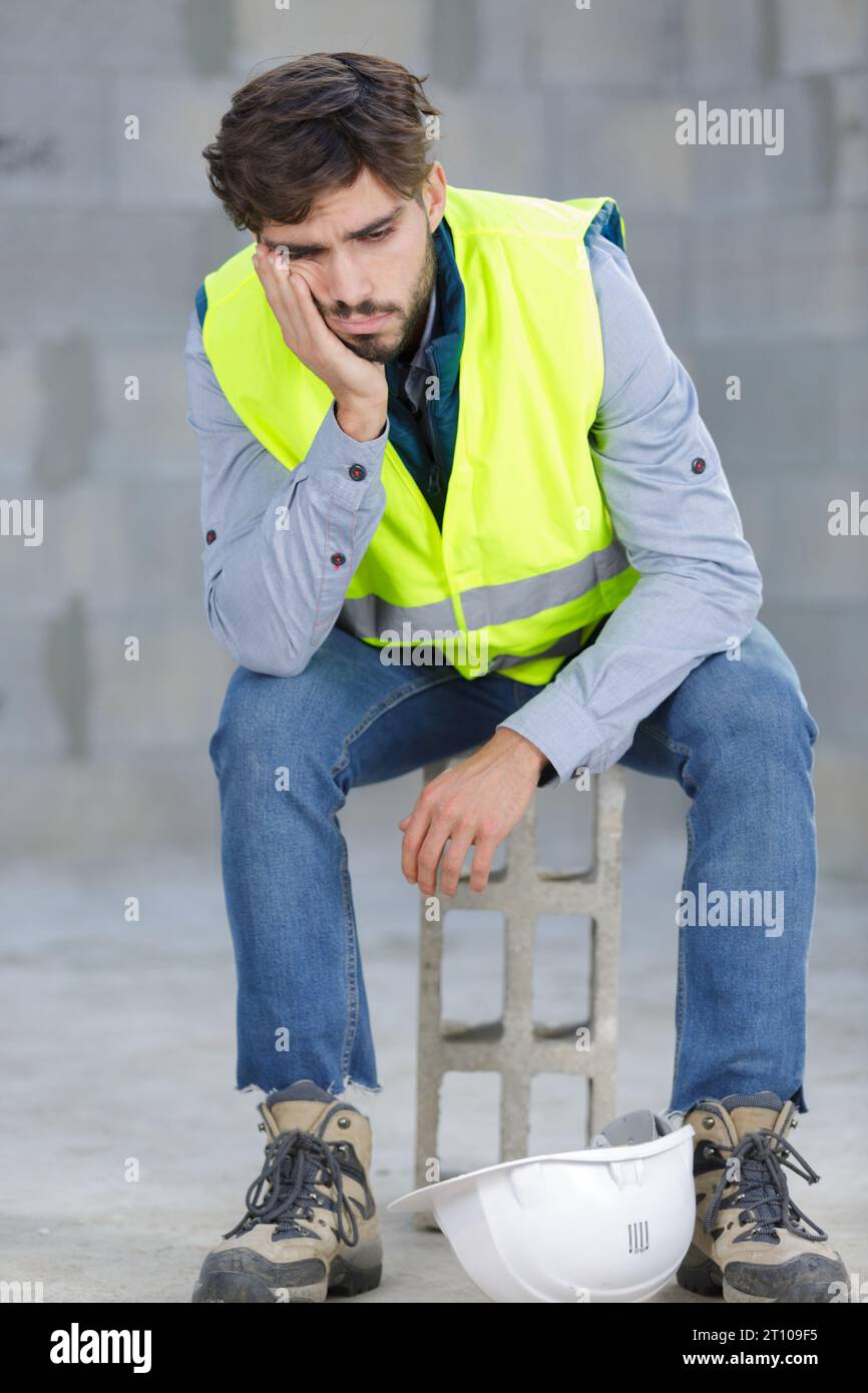 Sad builder hi-res stock photography and images - Alamy