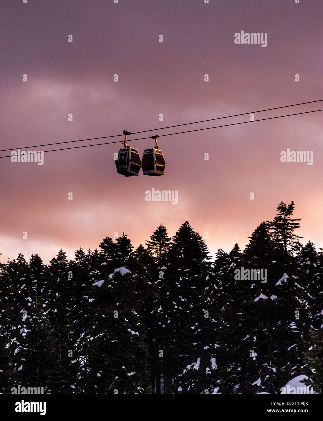 Aerial Romance, Two cable cars share a passionate hug above the snowy ...