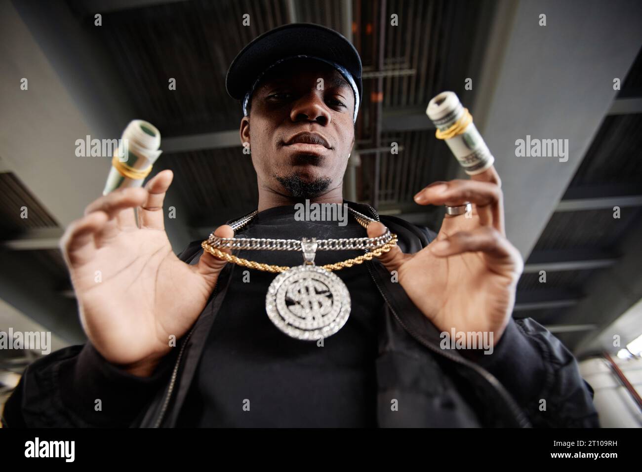 Young African American male rapper with thick chain and medallion on ...