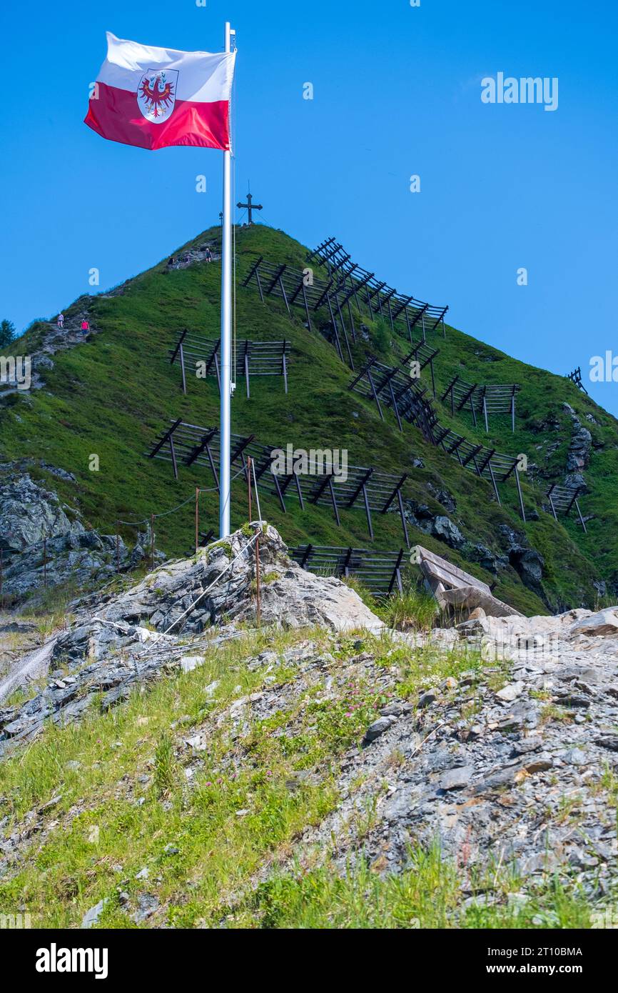 Tyrol flag at viewpoint near the peak of Wiedersberger Horn mountain ...