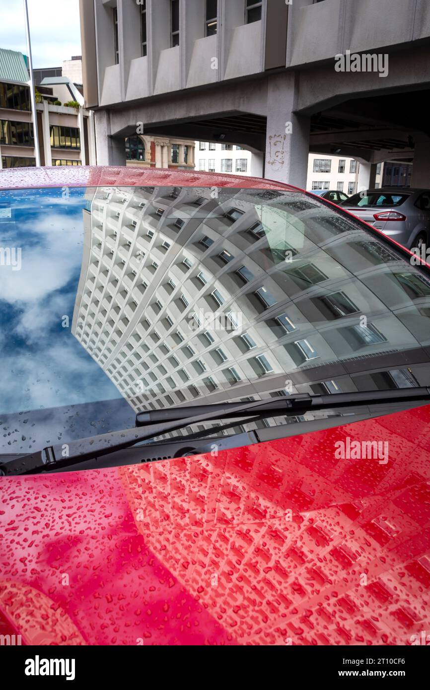 Office building reflected in car windscreen, Wellington, North Island ...
