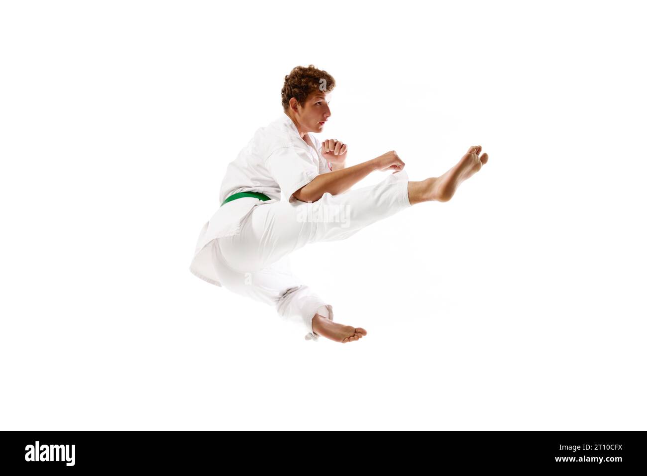 Flying kicks. Professional martial arts athlete, karateka in white ...