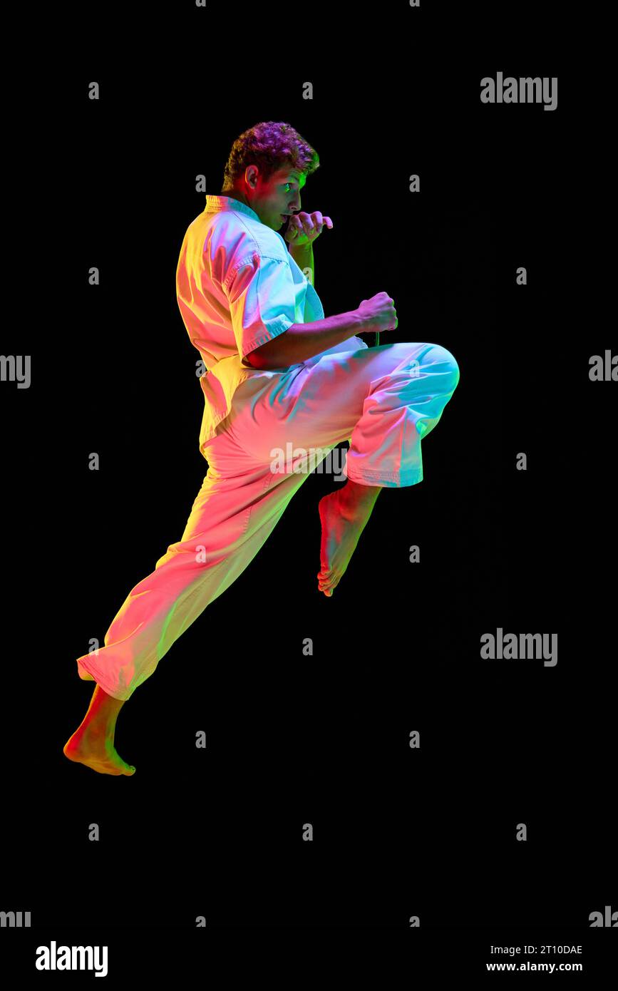 Professional martial arts athlete in motion, training, practicing ...