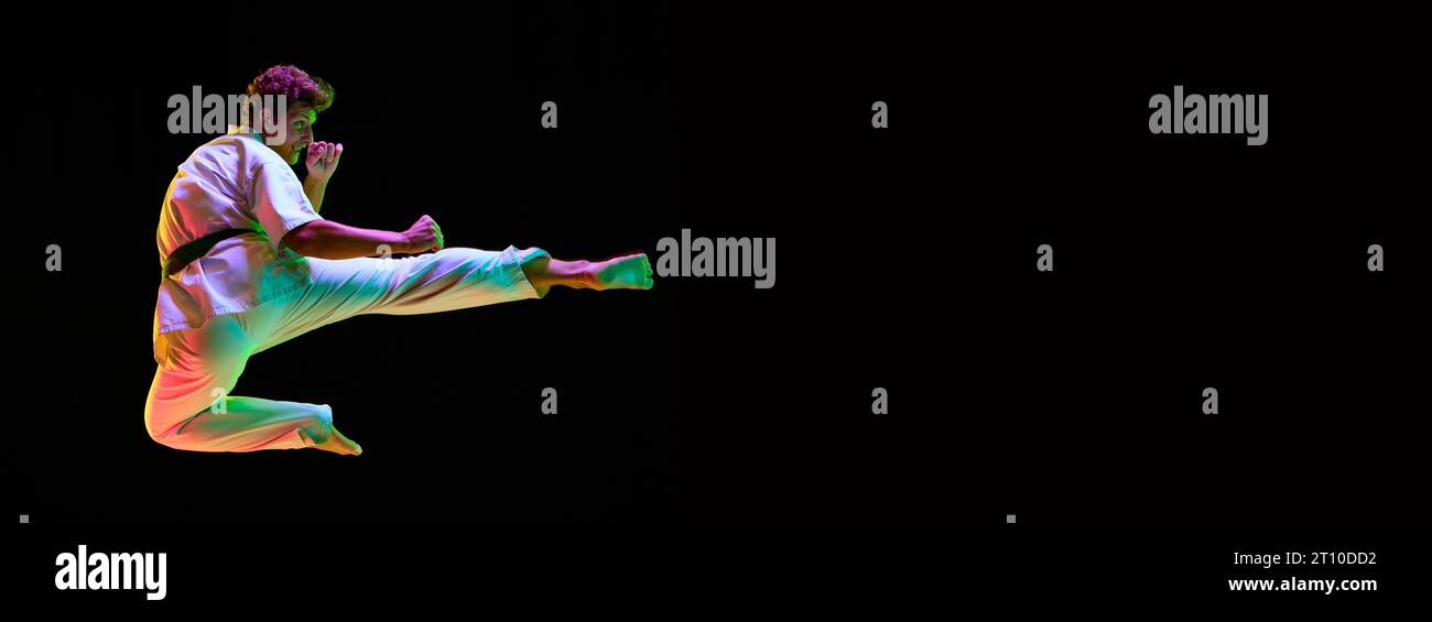 Dynamic image of young man, karate athlete in motions, training over ...