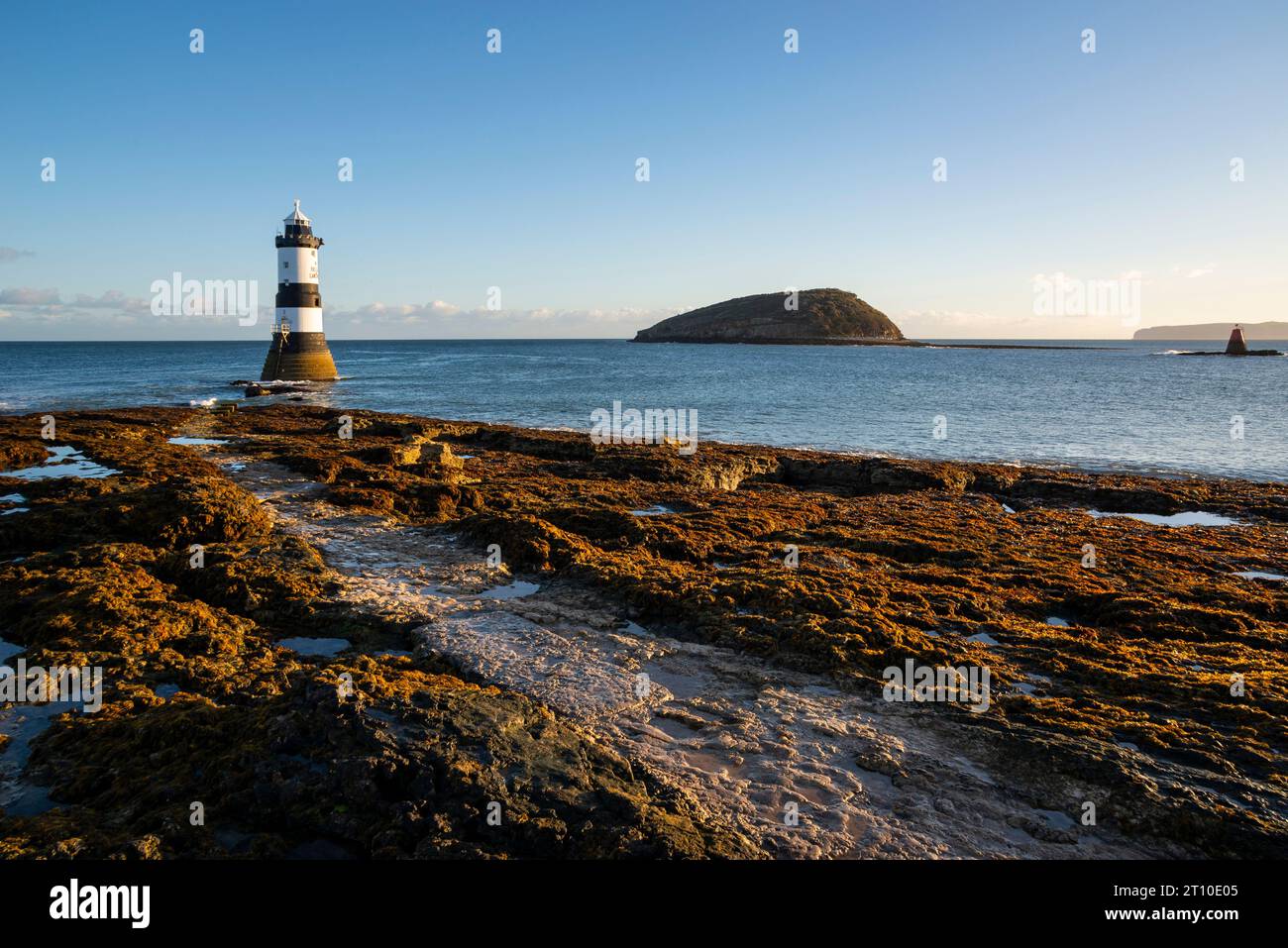 Penmon Point on the coast of Anglesey, North Wales. Trwyn Du Lighthouse ...