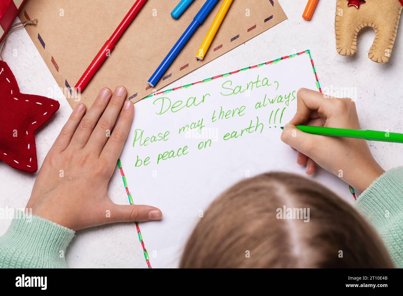A child writes a letter to Santa Claus asking for world peace Stock ...