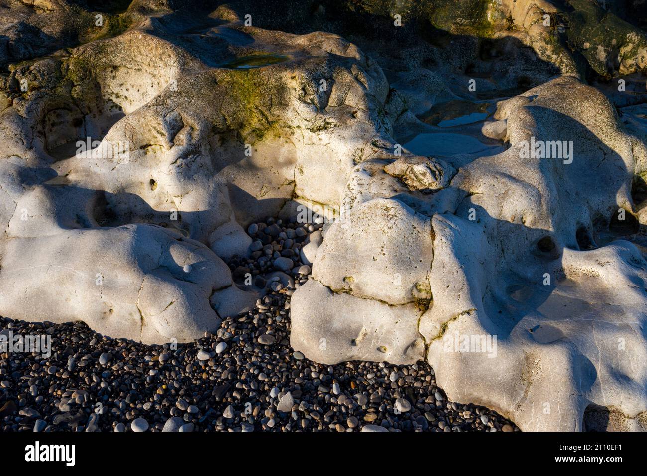 Weathered rocks on the beach at Penmon Point, Anglesey, North Wales ...