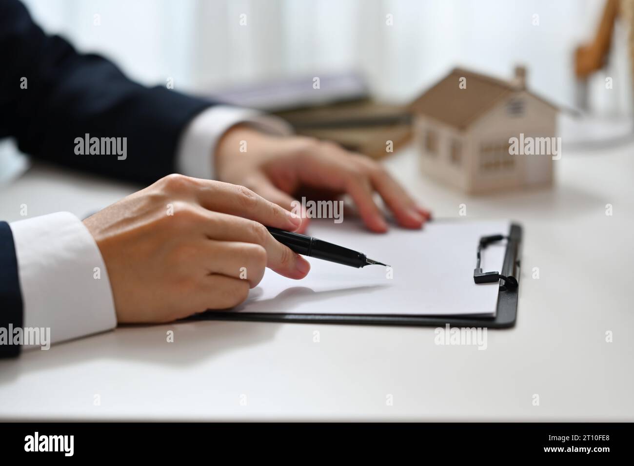 Real estate agent hand holding pen pointing at contract document. Real ...