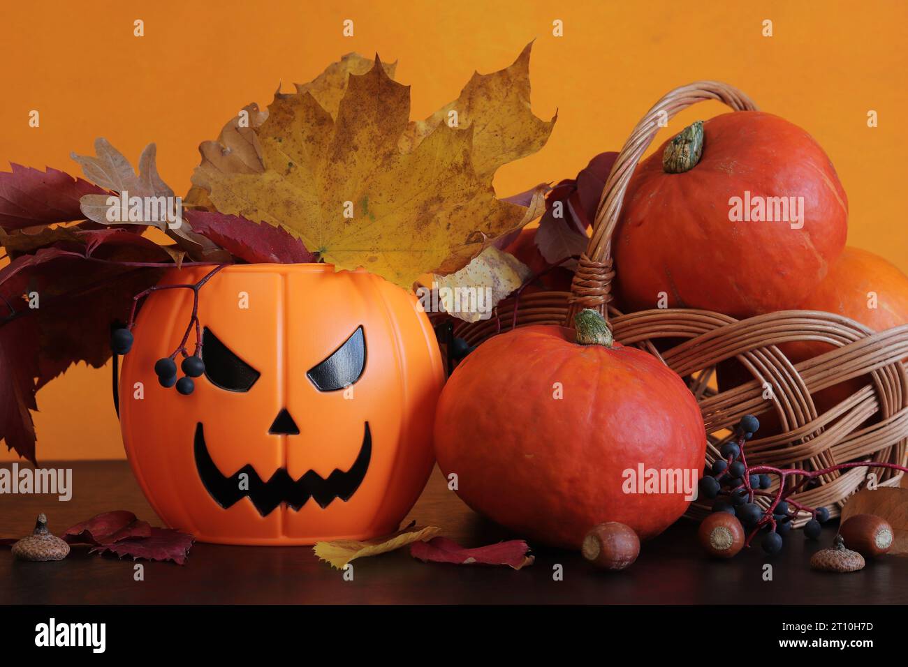 Happy Halloween. Plastic pumpkin bucket with an evil smile, ripe ...