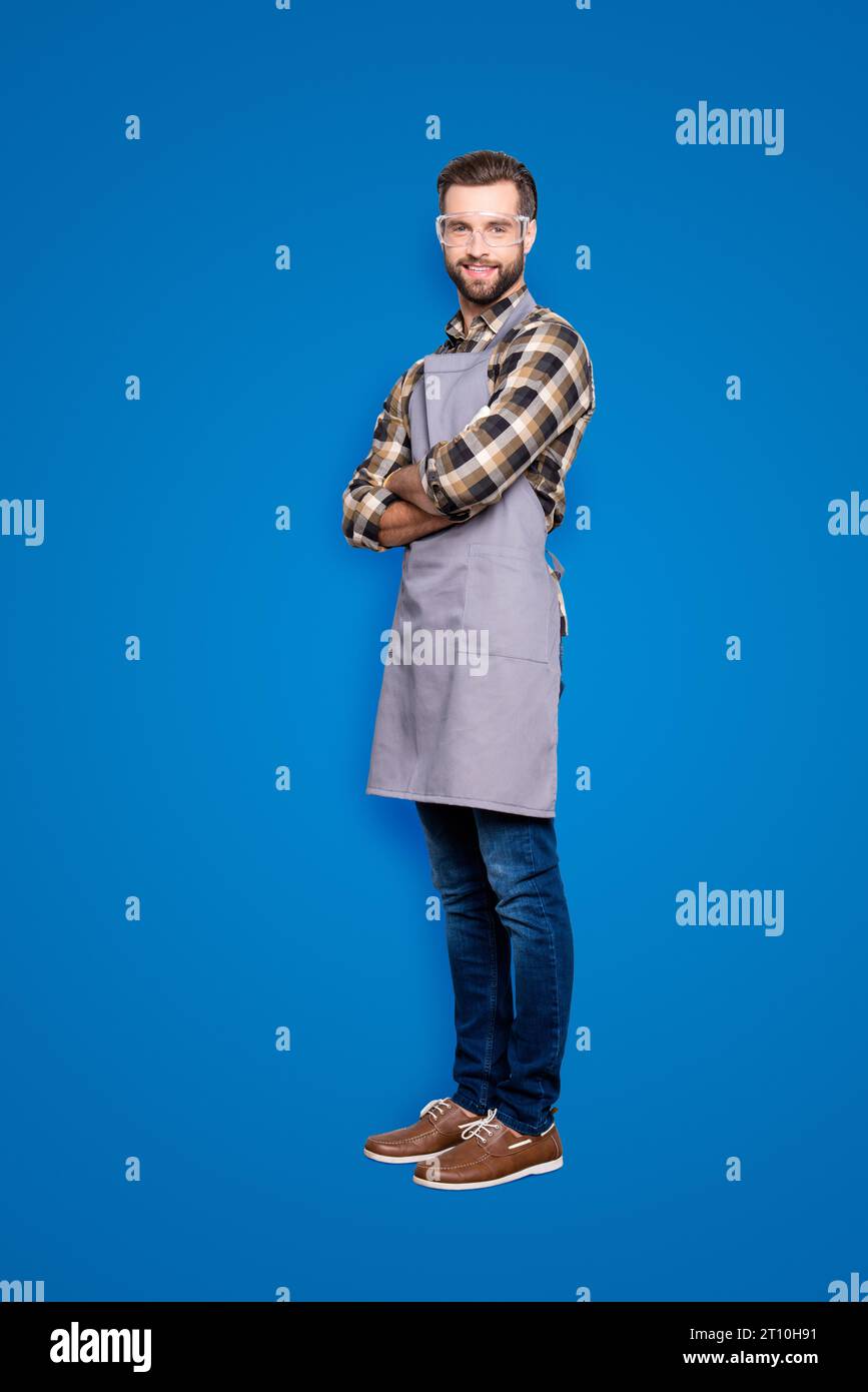 Full size body snap portrait of attractive cheerful carpenter with ...