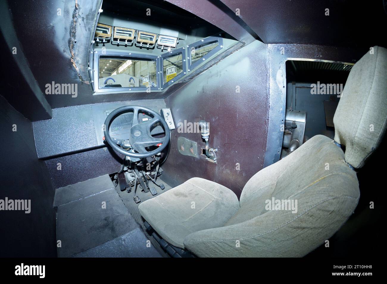 Interior of an armored vehicle driver compartment steering wheel and ...