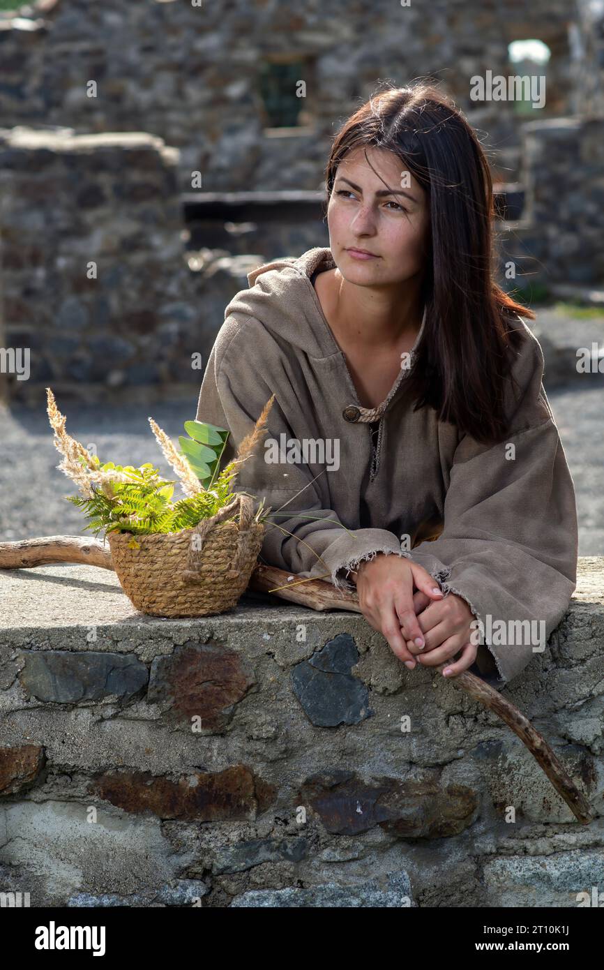 Self-confident medieval castle resident with long hair Stock Photo - Alamy