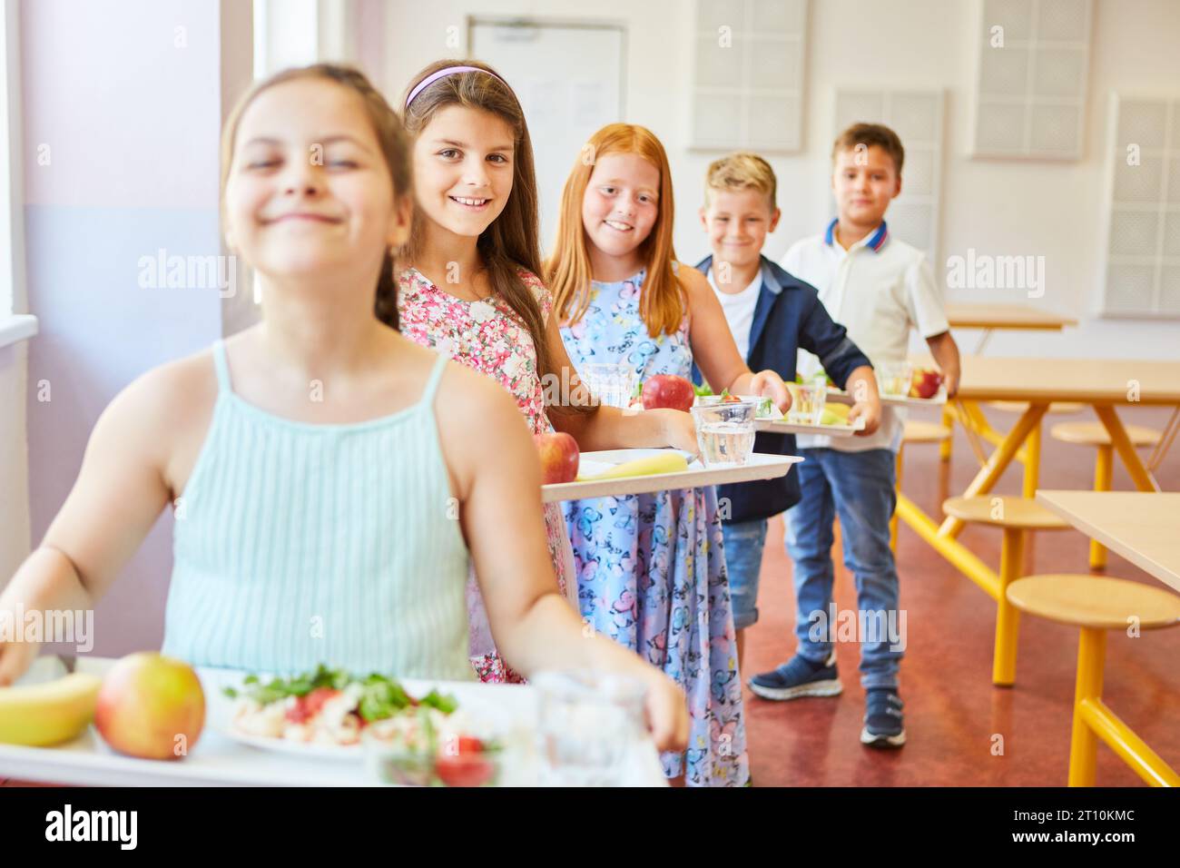 Children in canteen queue hi-res stock photography and images - Alamy