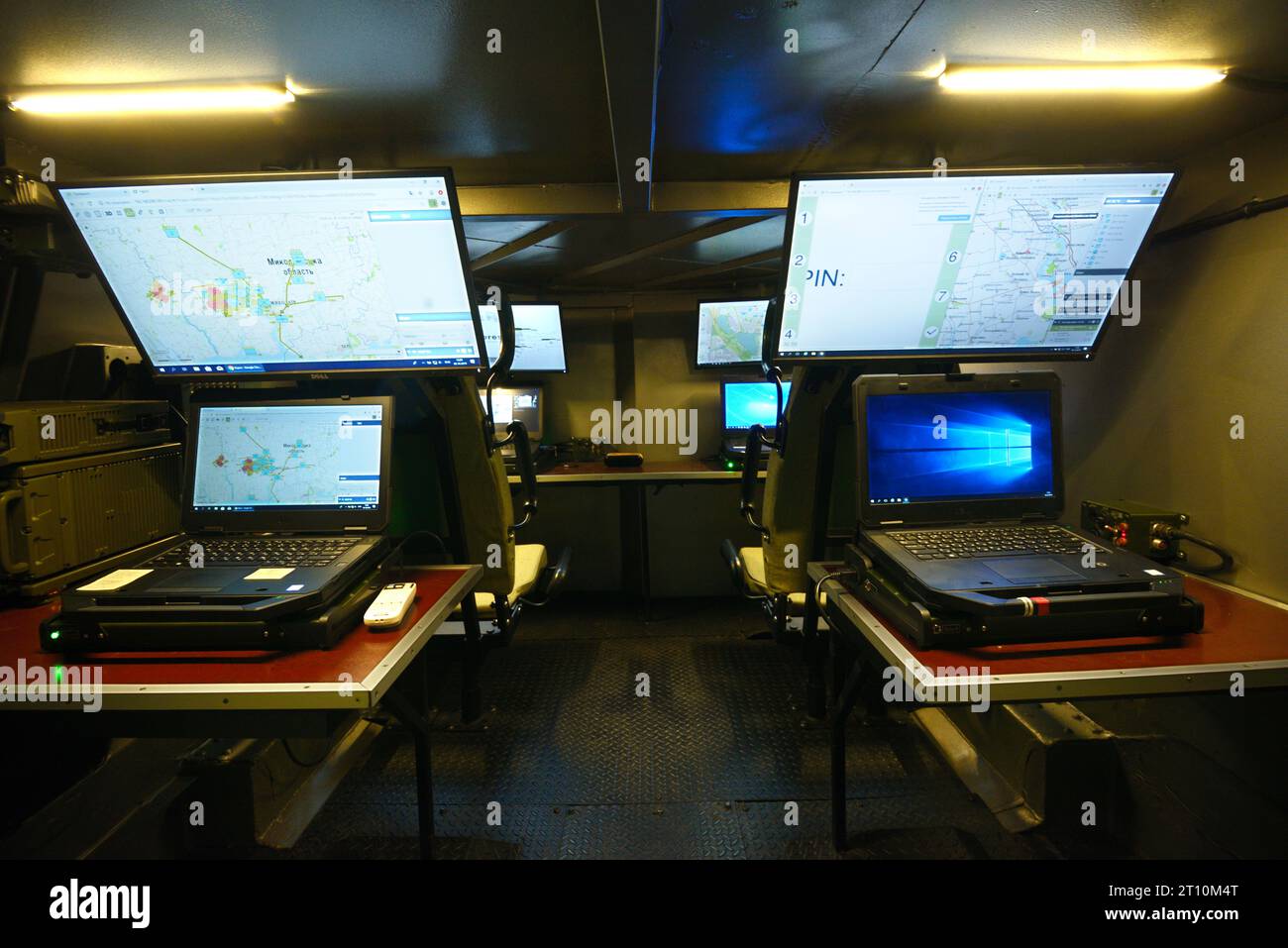 Mobile command centre. Operator workplace computers, monitors and seats ...
