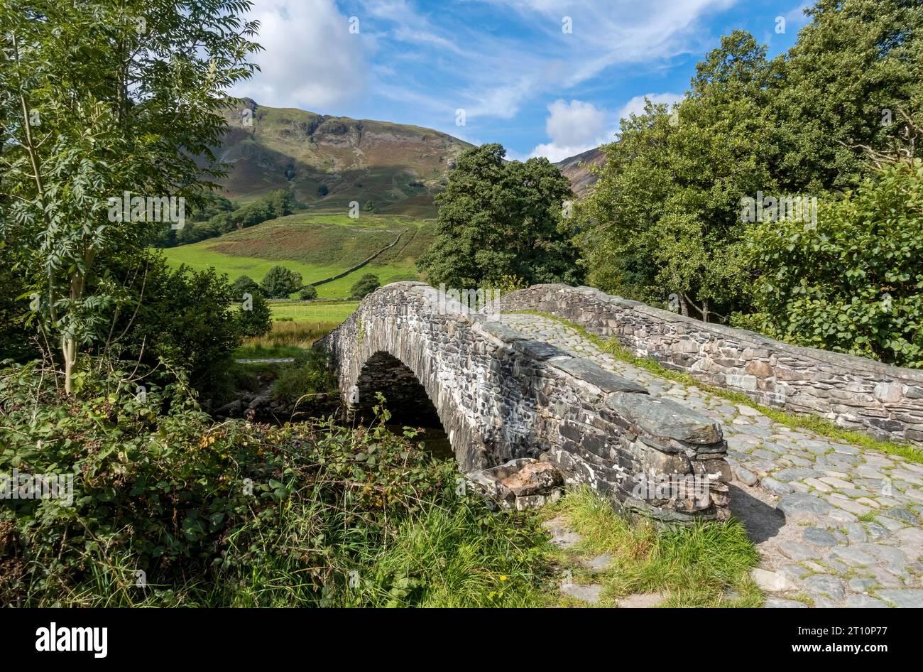 Stone Bridge across River Derwent on the Cumbria Way in summer ...