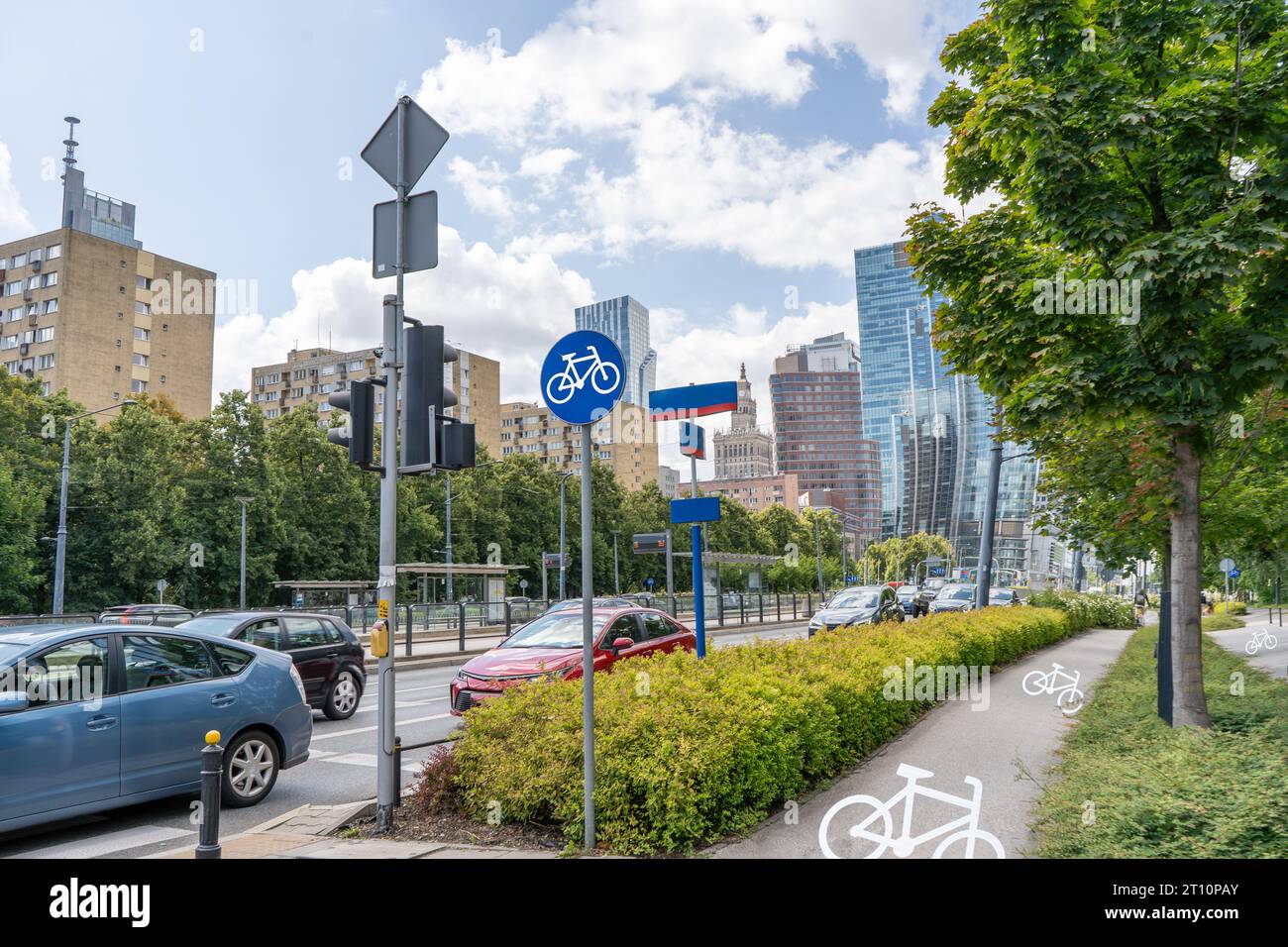 Bicycle path in the center city. Car on the road traffic jam. Bicycle ...