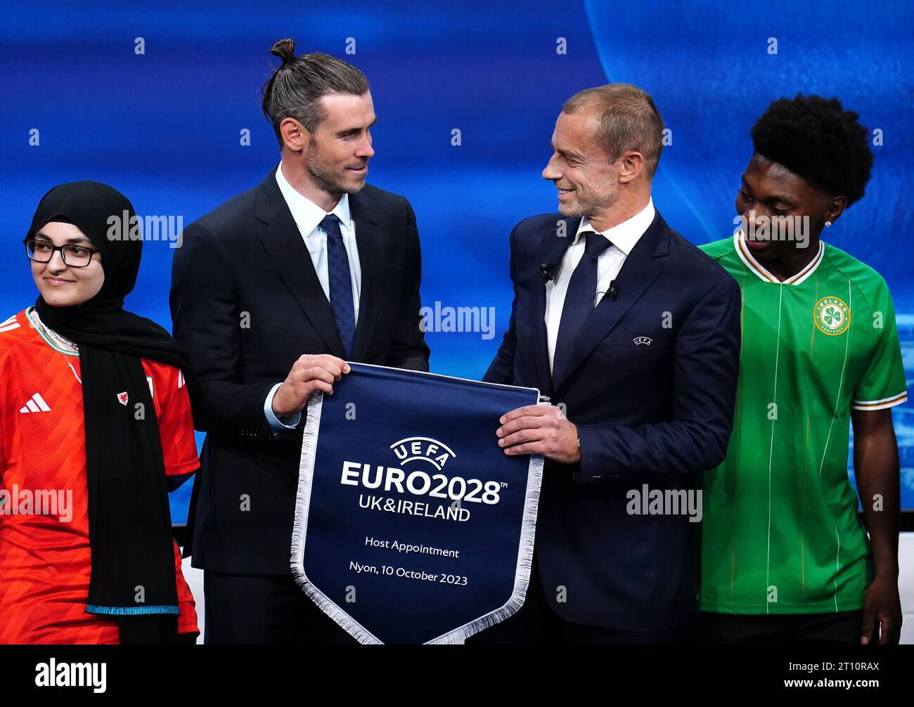 Wales delegate Gareth Bale and UEFA president Aleksander Ceferin hold a ...
