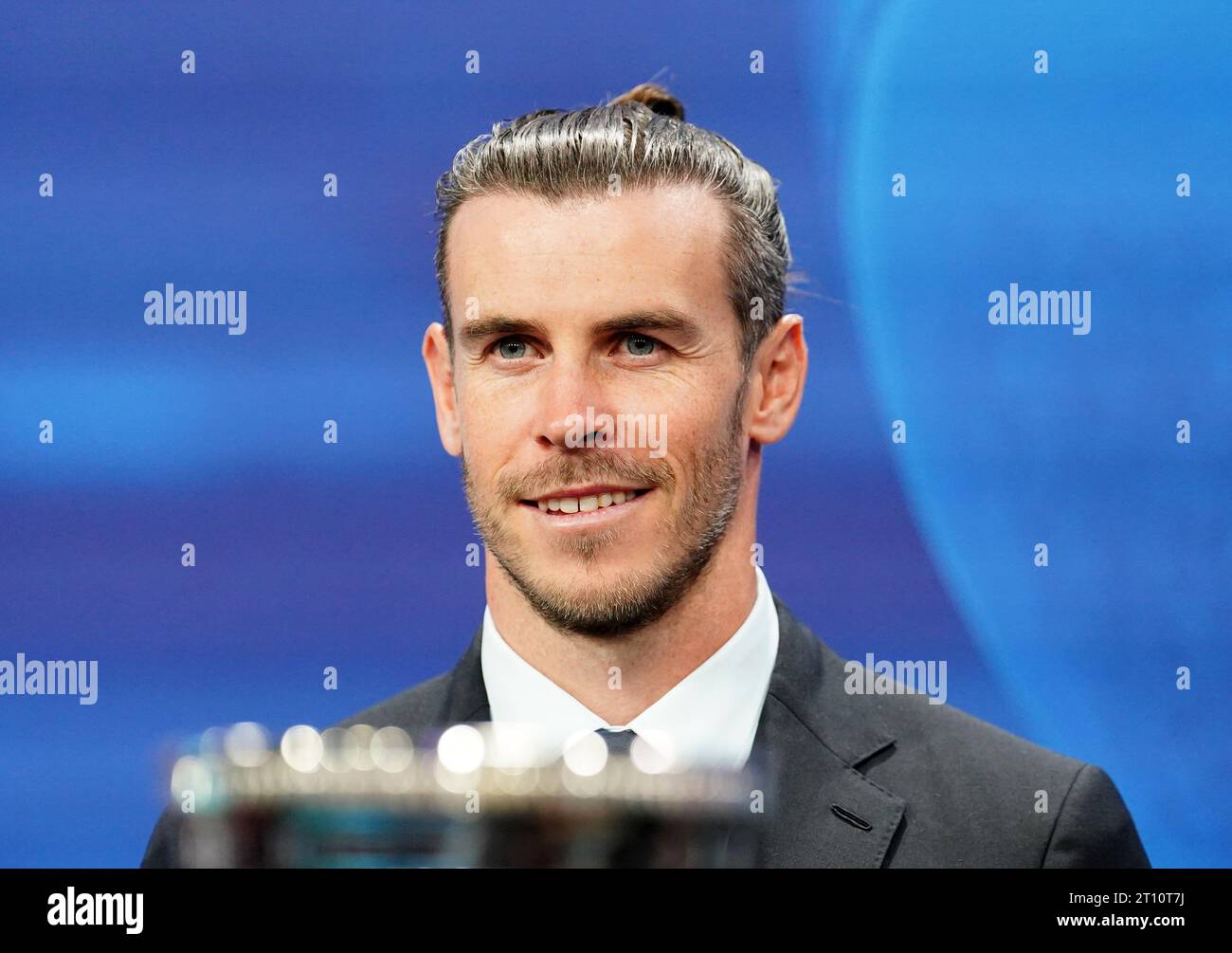 Wales delegate Gareth Bale stands next the the European Championship trophy during the Euro 2028 ...