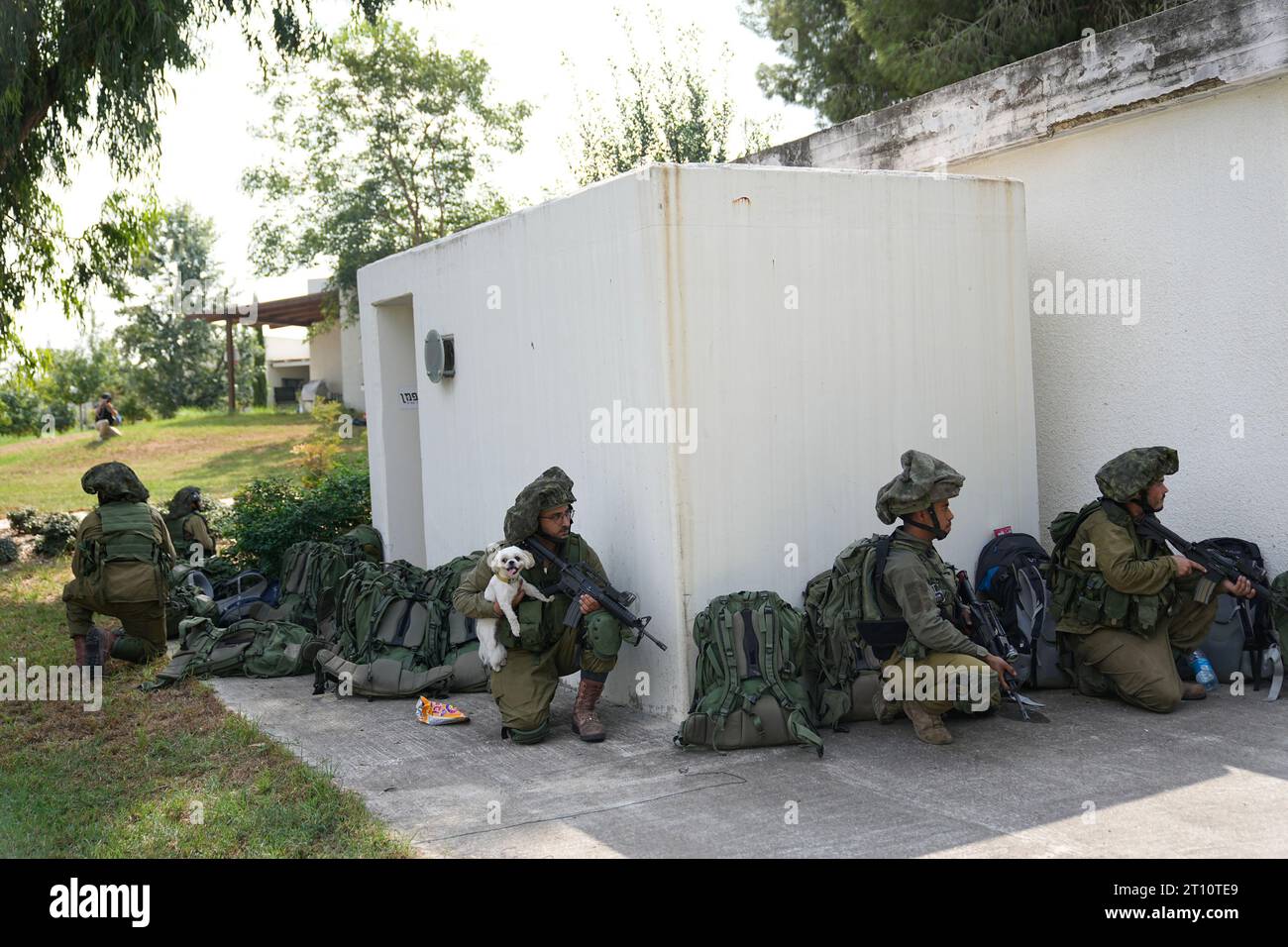 Israeli soldiers deploy in kibbutz Kfar Azza on Tuesday, Oct. 10, 2023 ...