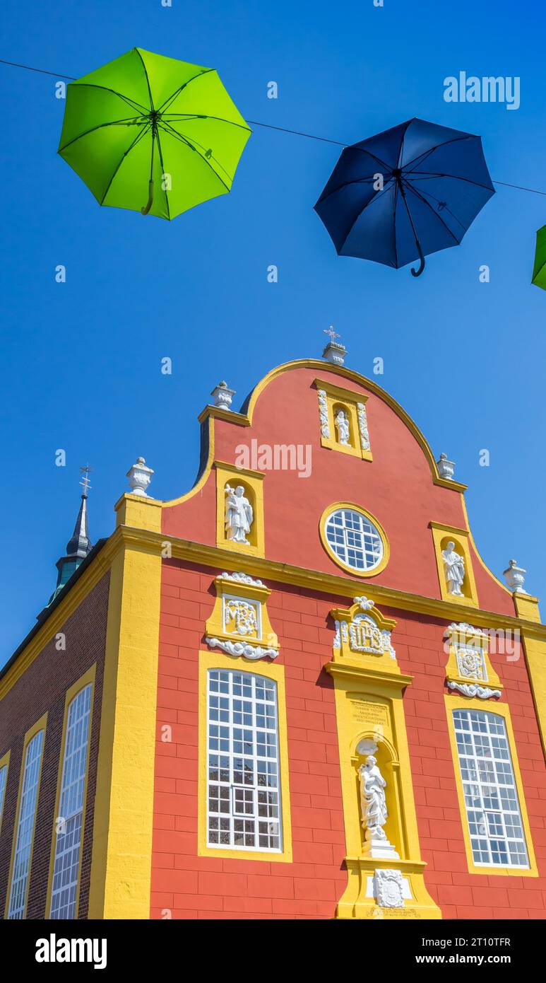 Colorful green and blue umbrellas in front og the Gymnasialkirche ...