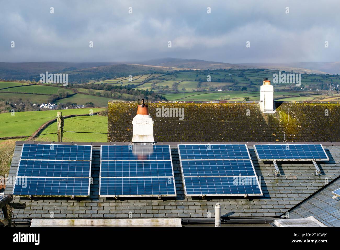Solar panels on a domestic house roof with a beautiful countryside view ...