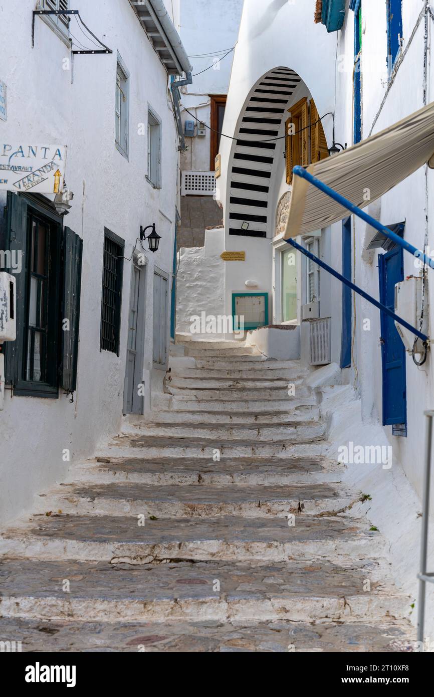 A street scene on the Greek Island of Hydra. The white and blue color ...
