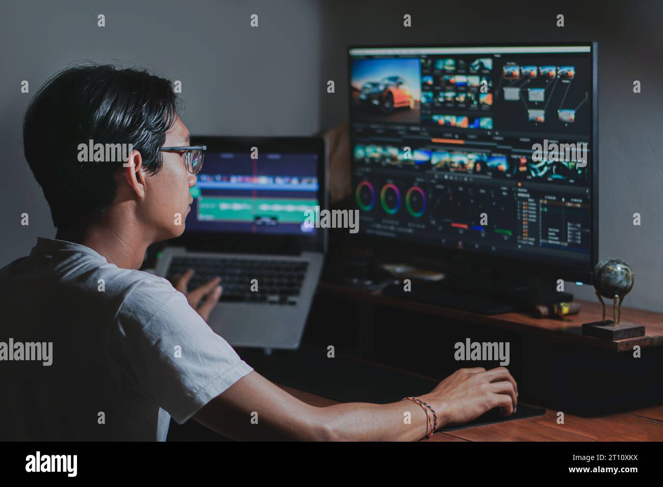Video editor working night hi-res stock photography and images - Alamy