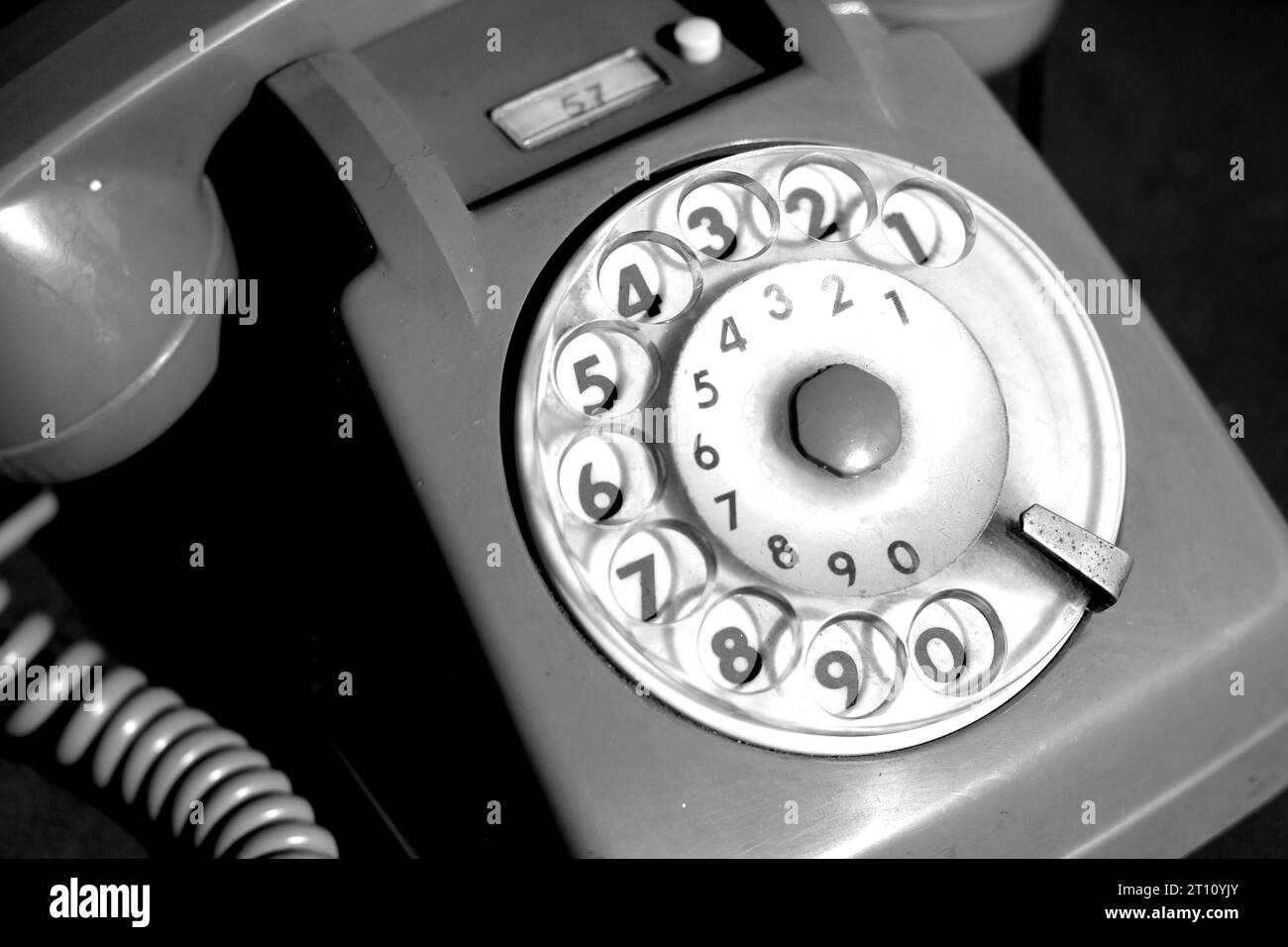 Old telephone 70s with rotary dial, Black and white Stock Photo - Alamy