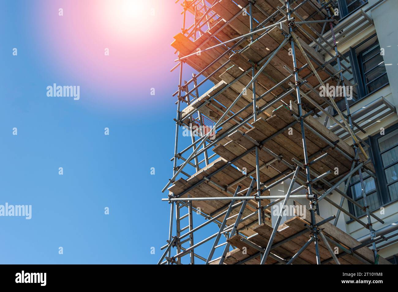 Scaffolding on multi storey building exterior during facade renovation ...