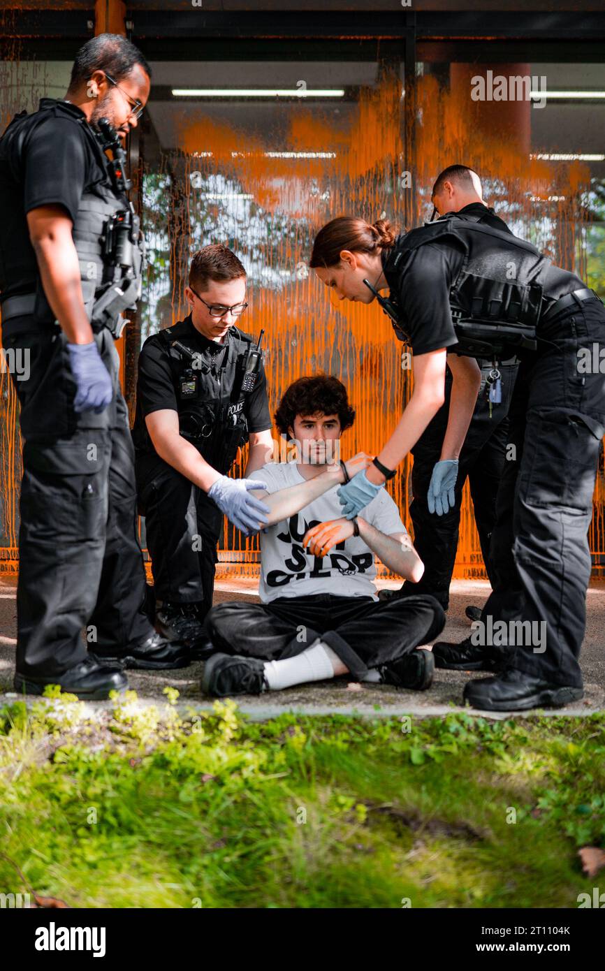 Ben, a 21-year-old student, paints a building at the University of ...