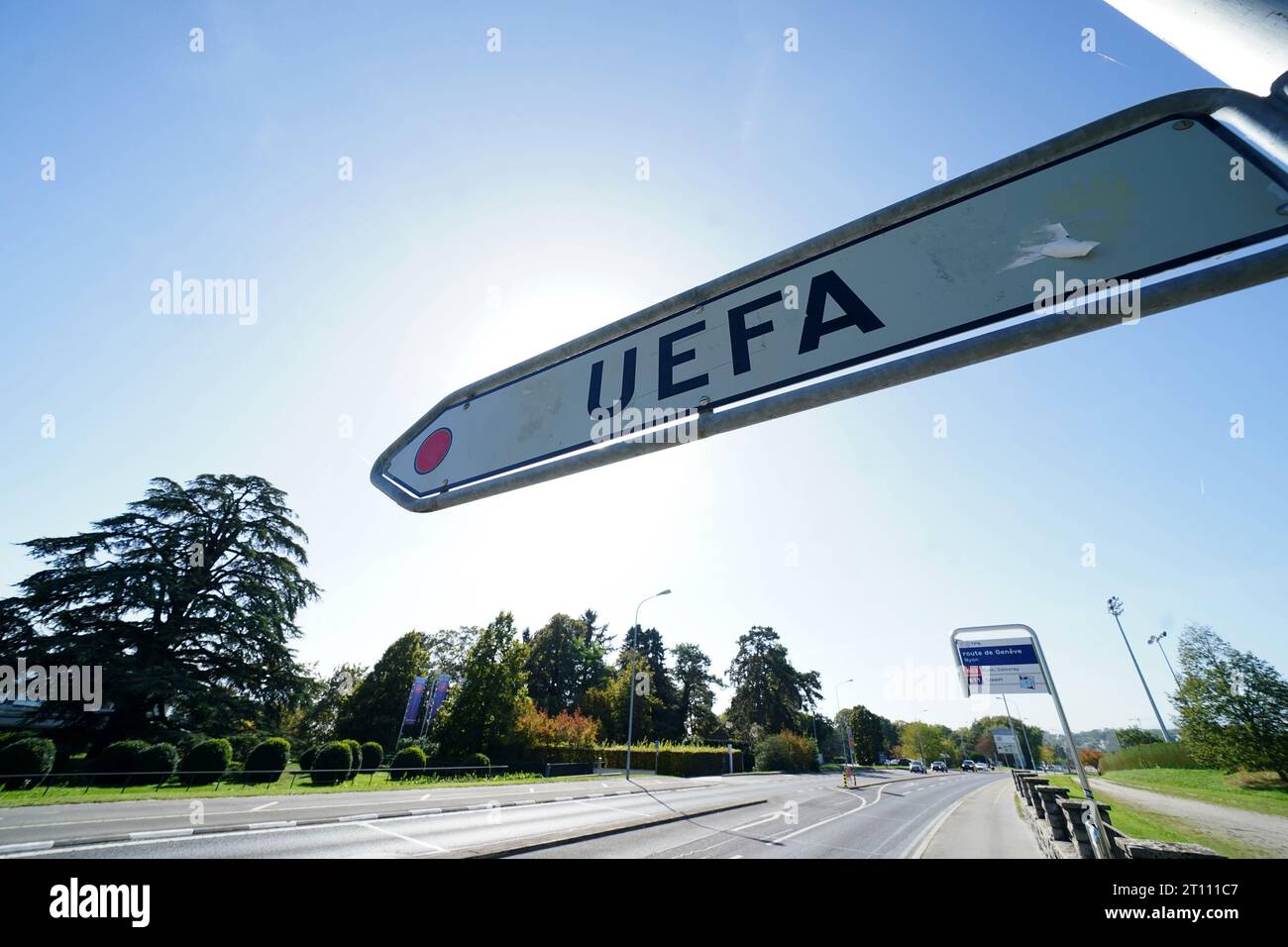 A signpost pointing towards the UEFA Headquarters in Nyon, Switzerland ...