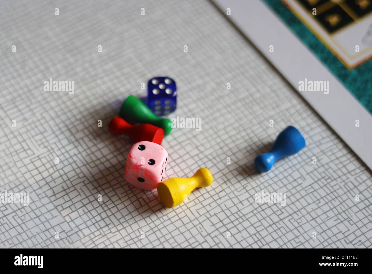 Ready for a board game. Colored chips and playing dices laid out on a ...