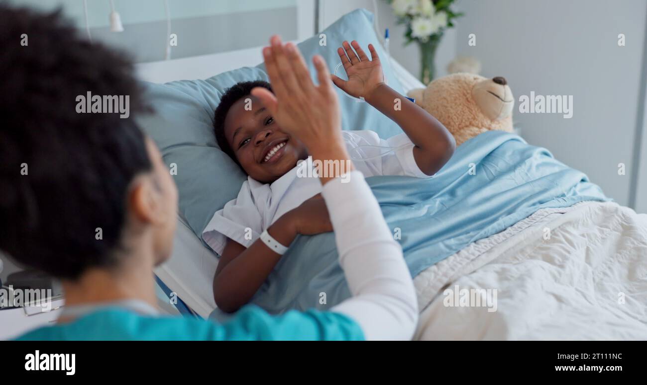Happy woman, doctor and high five with kid patient for success ...