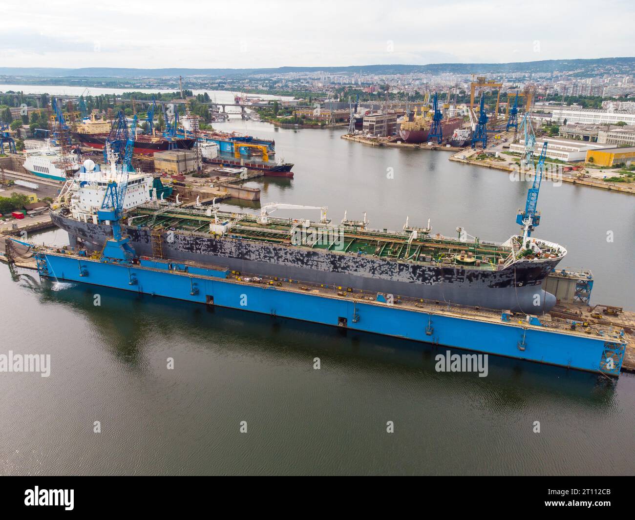 Tanker vessel repair in dry dock Shipyard, aerial top view Stock Photo ...