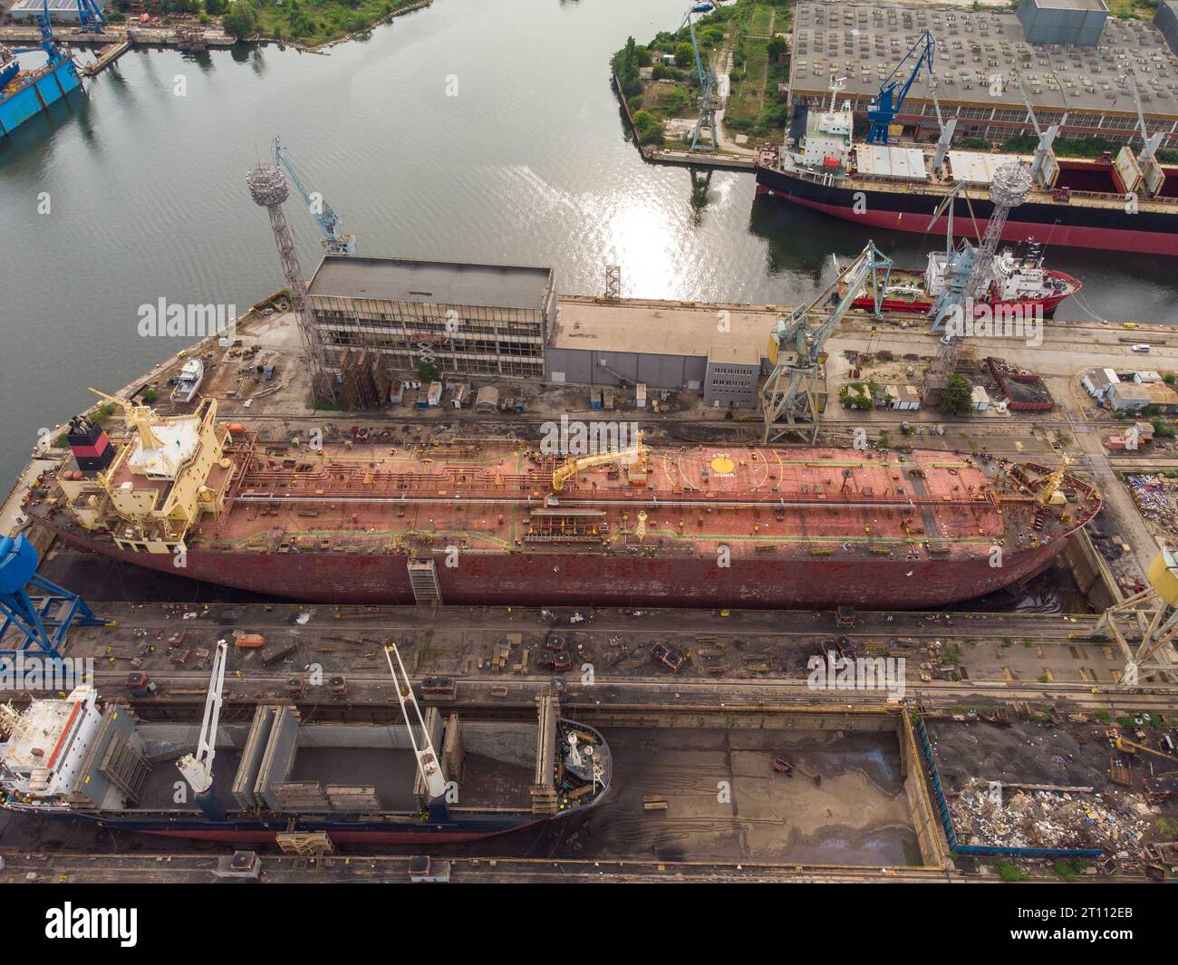 Tanker vessel repair in dry dock Shipyard, aerial top view Stock Photo ...