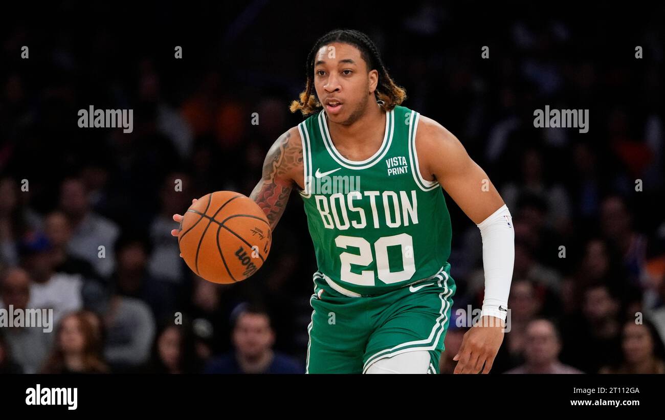 Boston Celtics' JD Davison (20) looks to pass during the first half of ...