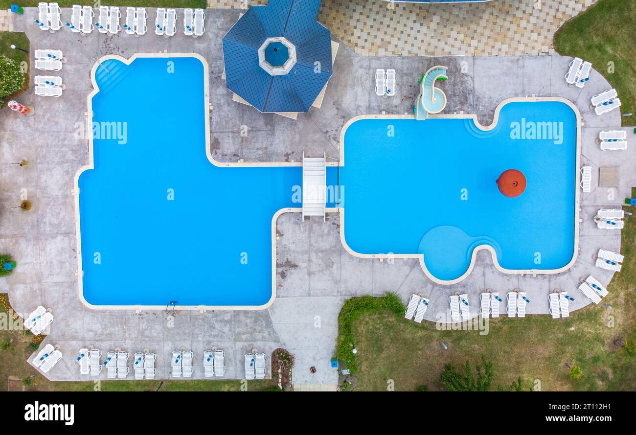Aerial top view on swimming pool in hotel Stock Photo - Alamy